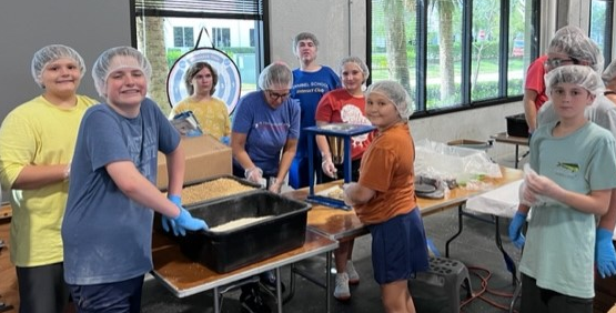 Sanibel School Interact Club Members Help Pack Food